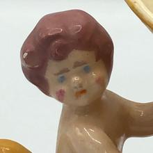 Baby riding a Cornucopia planter