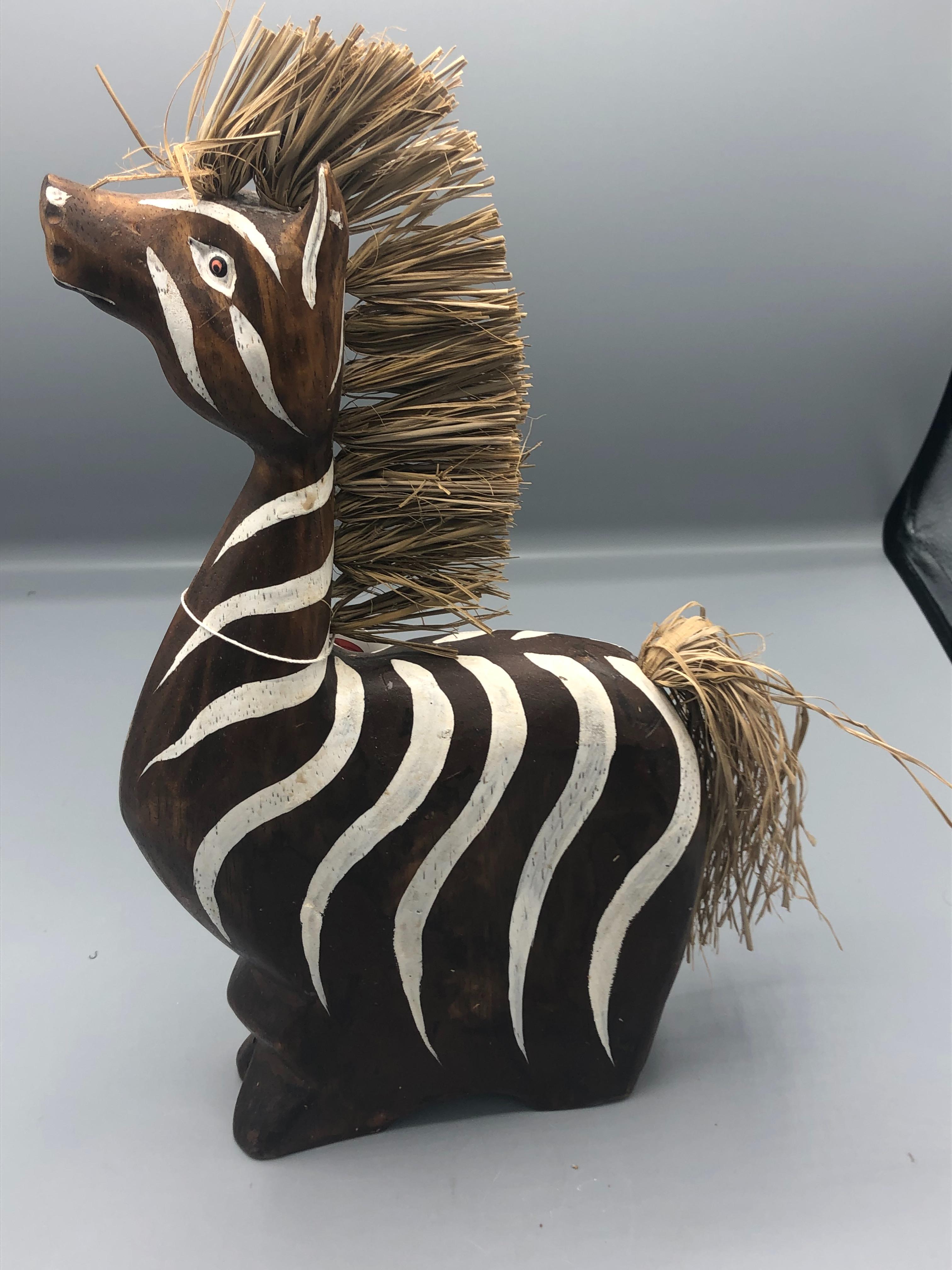 Wood giraffe with straw mane
