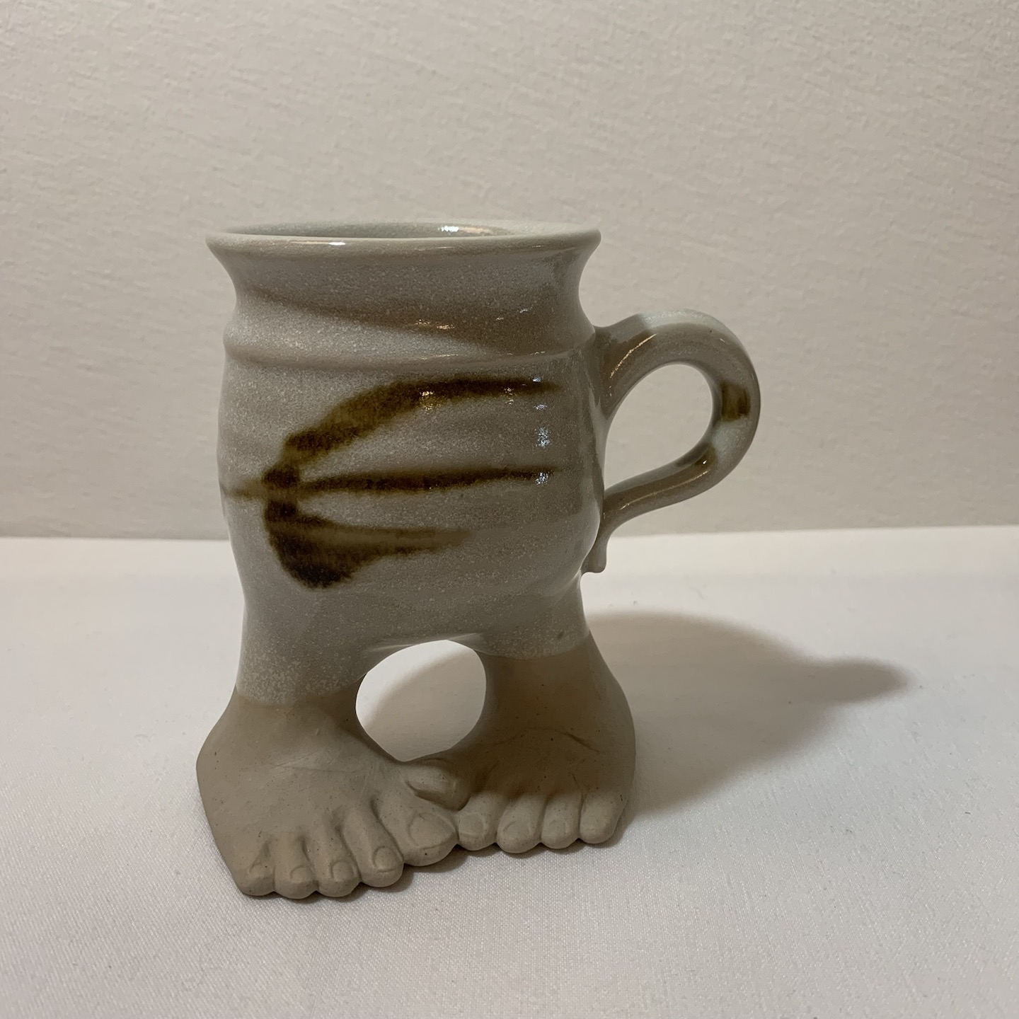 78. Vintage Stoneware Feet Coffee Mug