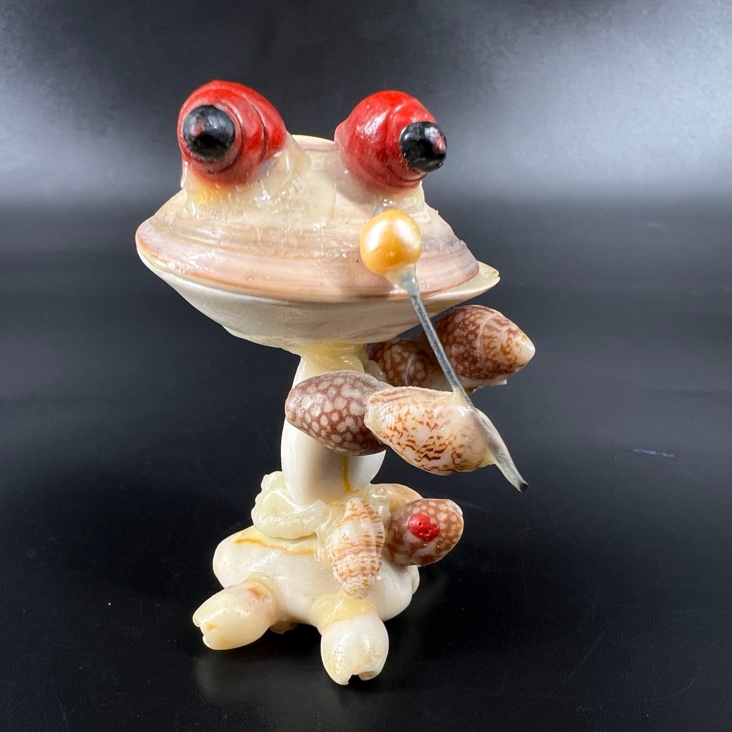 Shell Frog With Baton Riding A Turtle