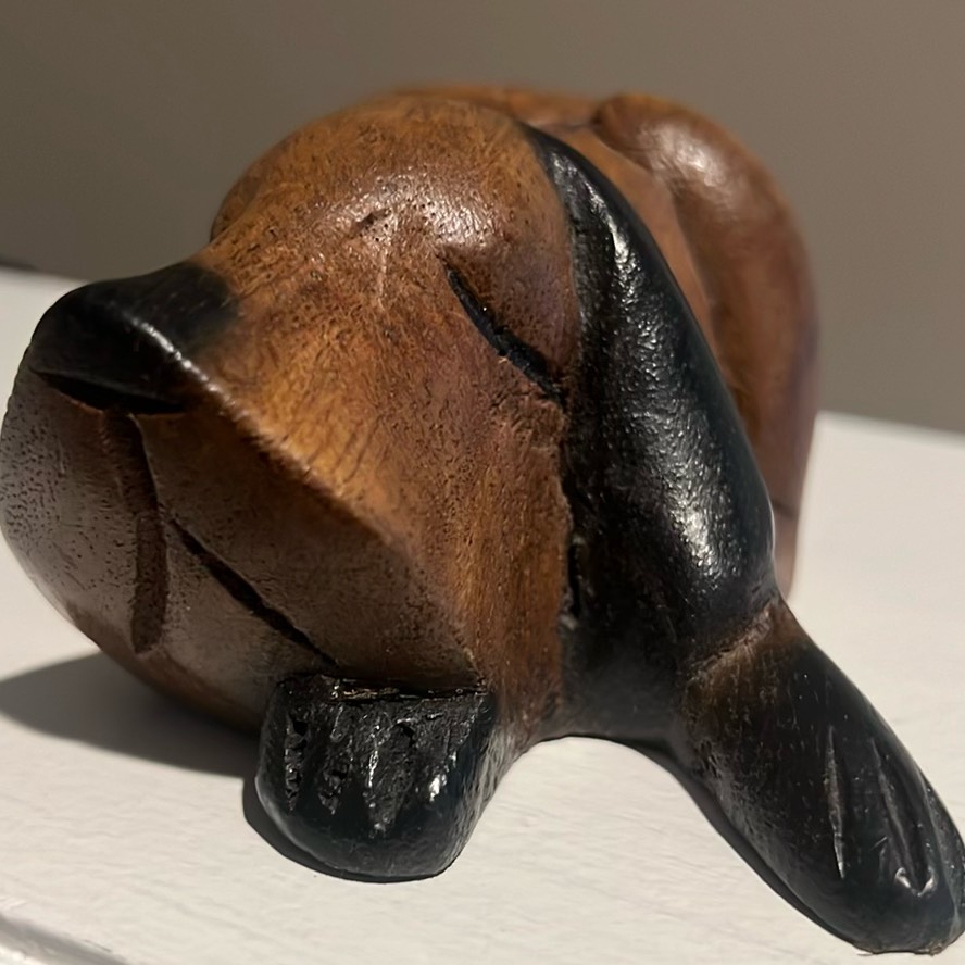 Hand carved wooden dog with the most adorable face