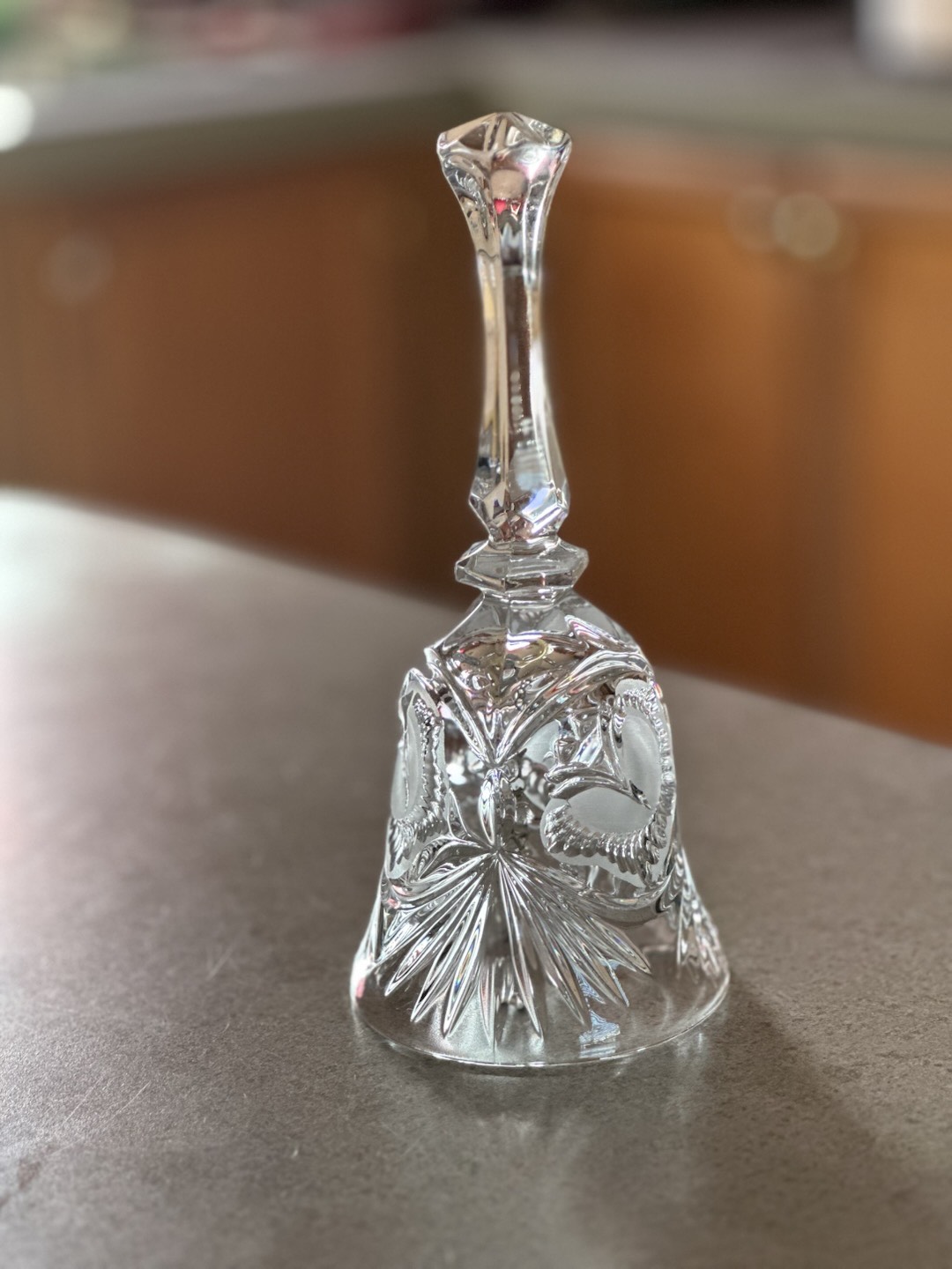 Lead crystal cut glass dinner bell with hobstar design.