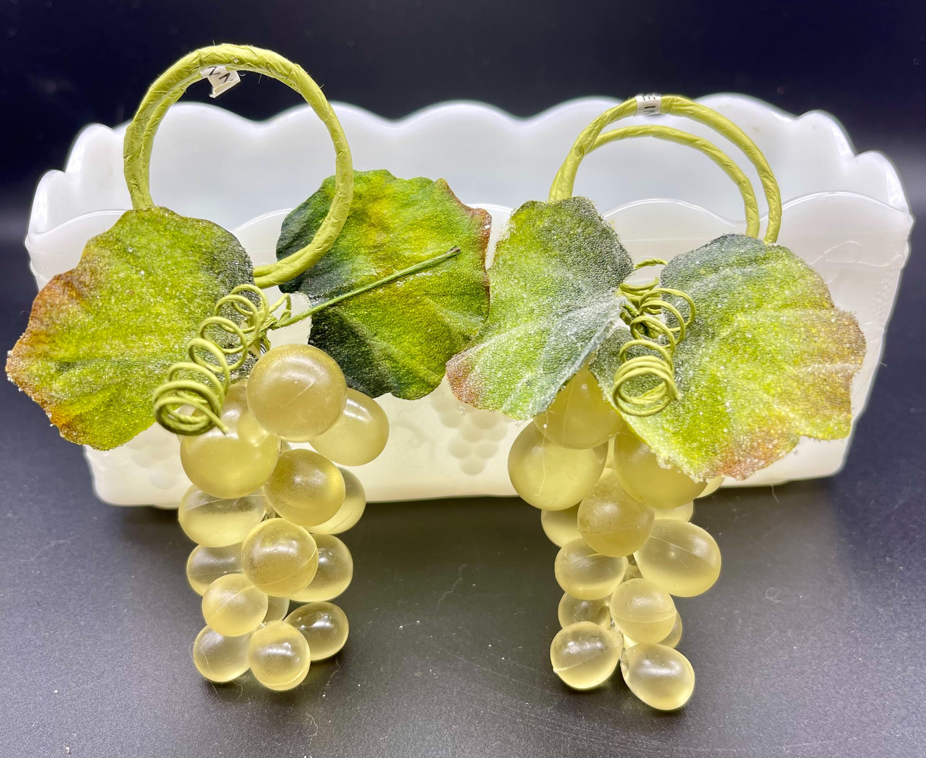 2 clusters of decorative green lucite (?) grapes.