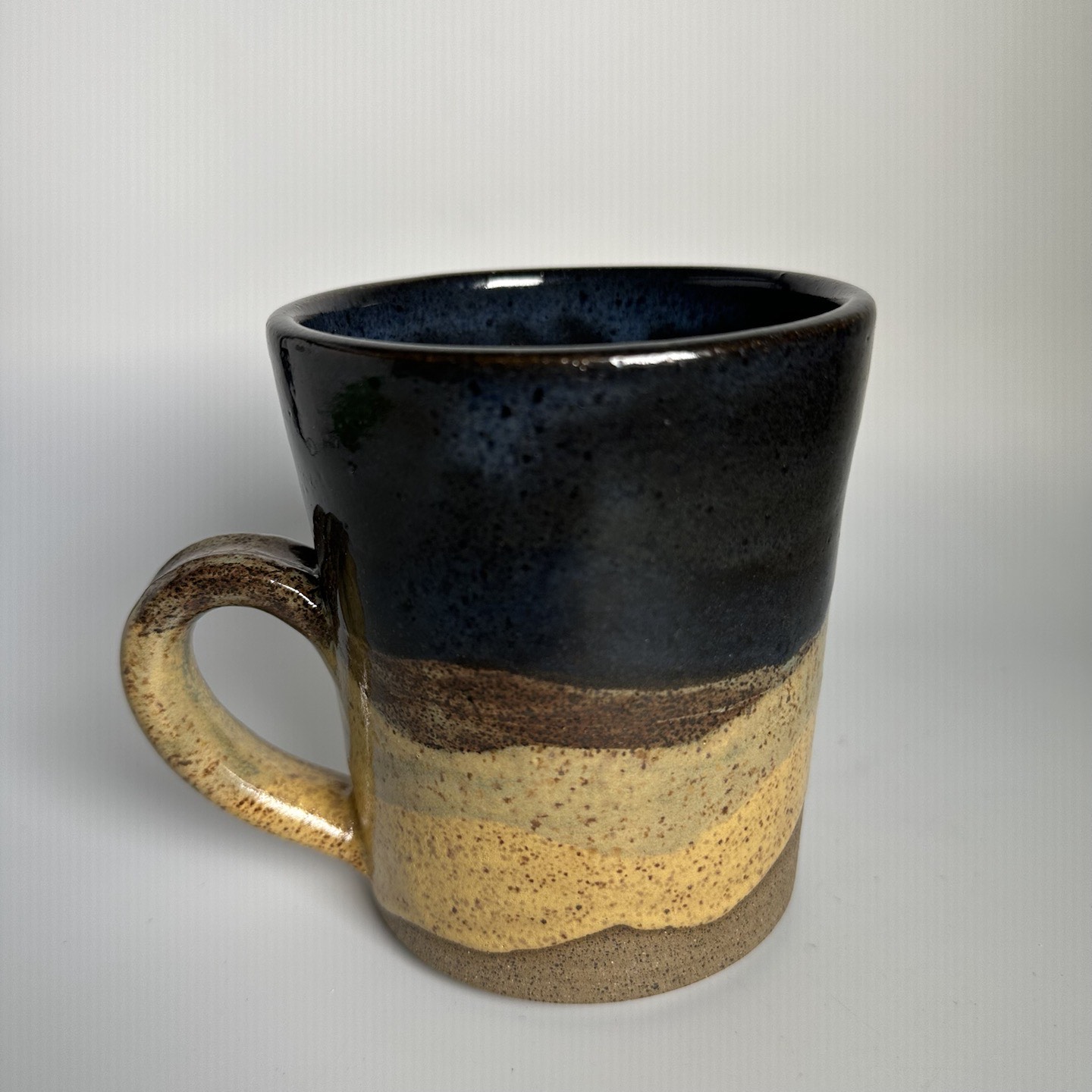 Rustic Stoneware Mug with Earthy Tones Signed Erika Ceramics