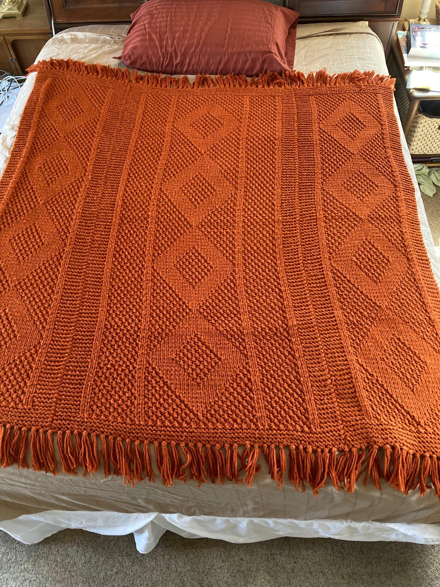 Crocheted afghan copper color