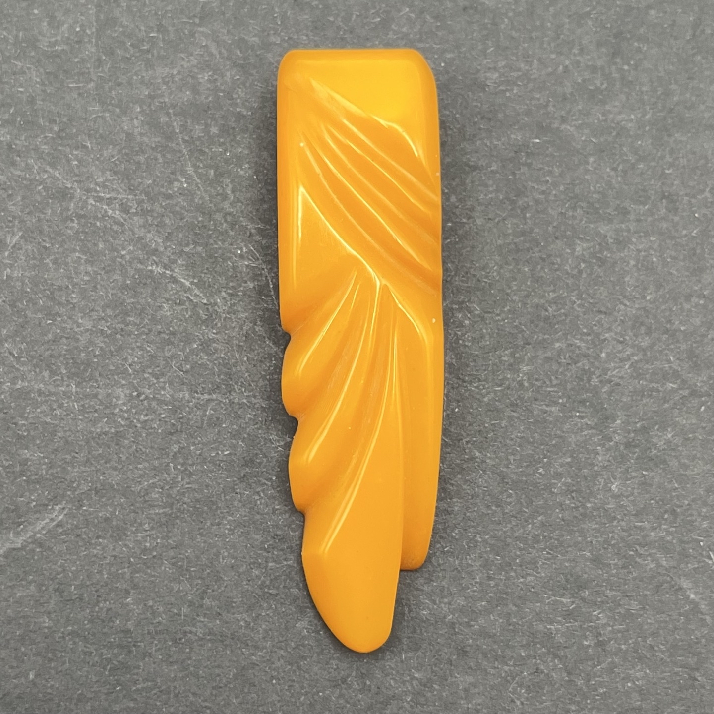 #19 - Butterscotch Carved Bakelite Dress Clip Tested