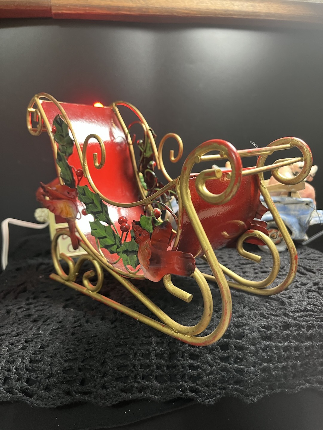 Red, Green and Gold Metal Sleigh w/ Cardinals and Holly Metal Accents.