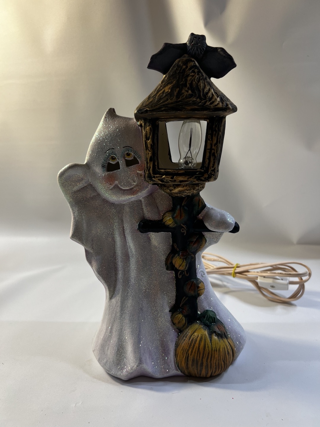 Vintage Ceramic Ghost Hanging On Lamppost With Pumpkin Garland And Bat