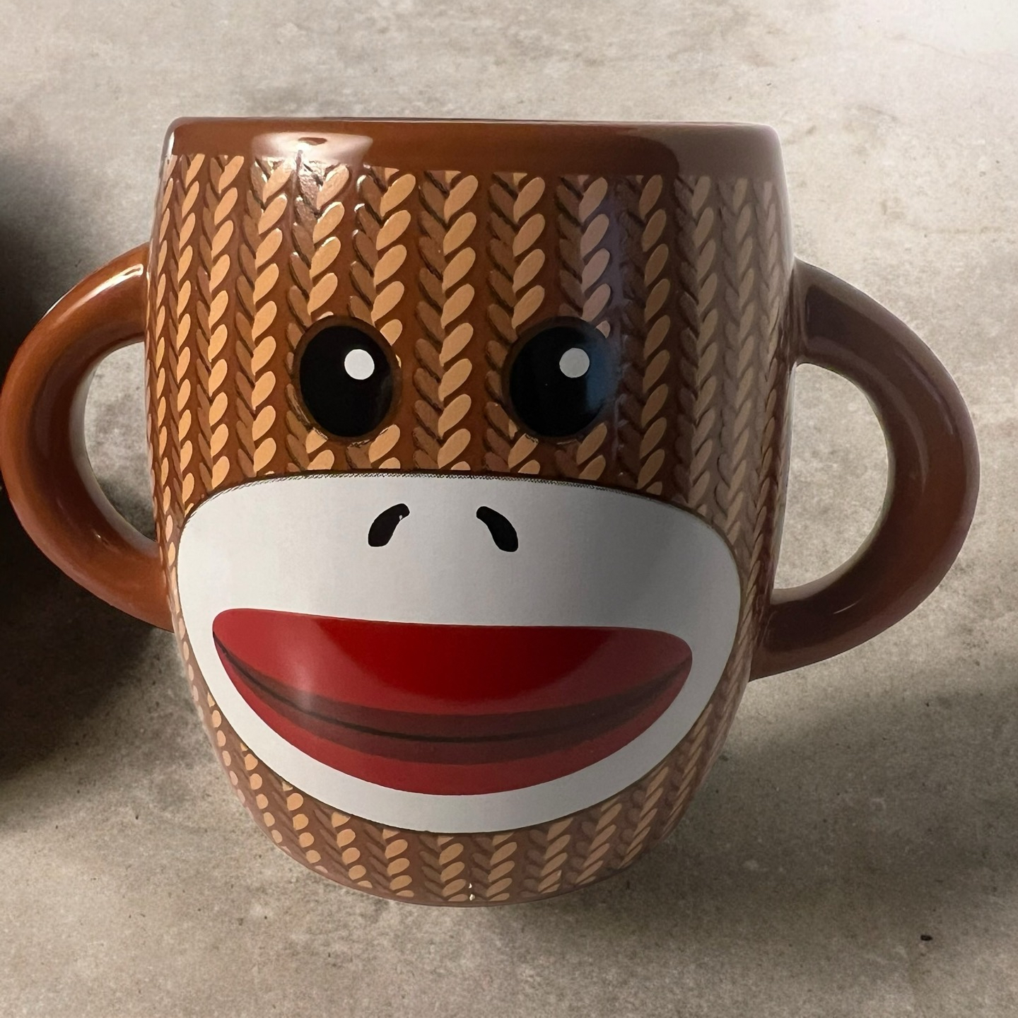 105. Ceramic Double Handle Sock Monkey Mug