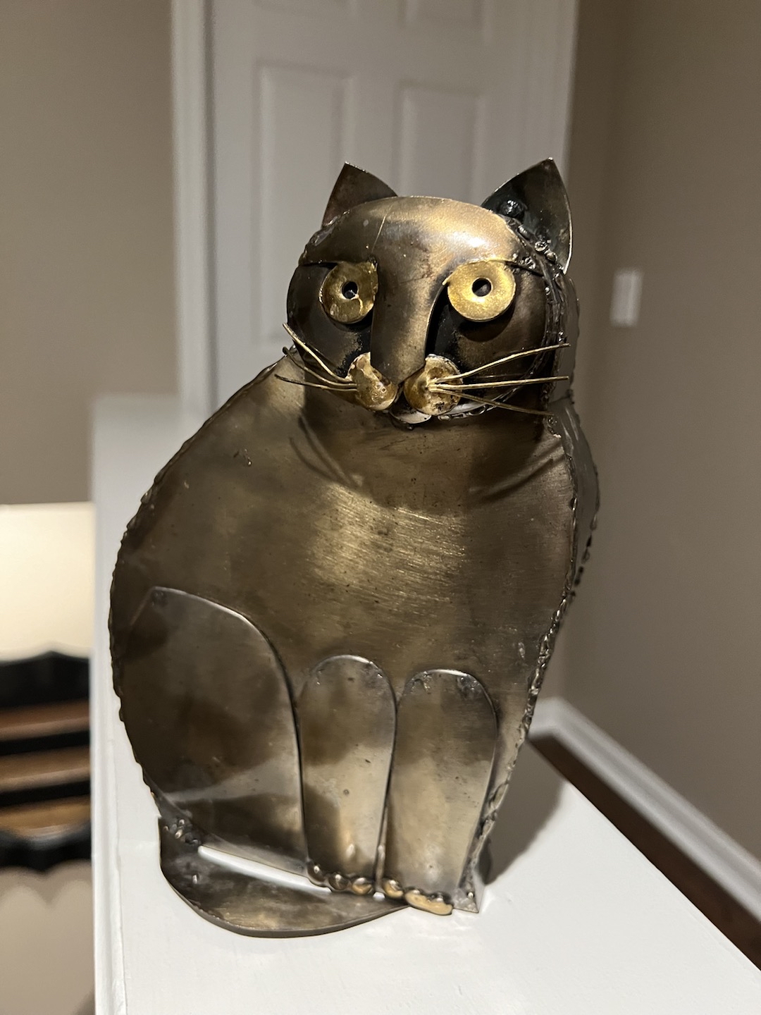 B) Hand welded, metal, brutalist, cat decor Made In Mexico