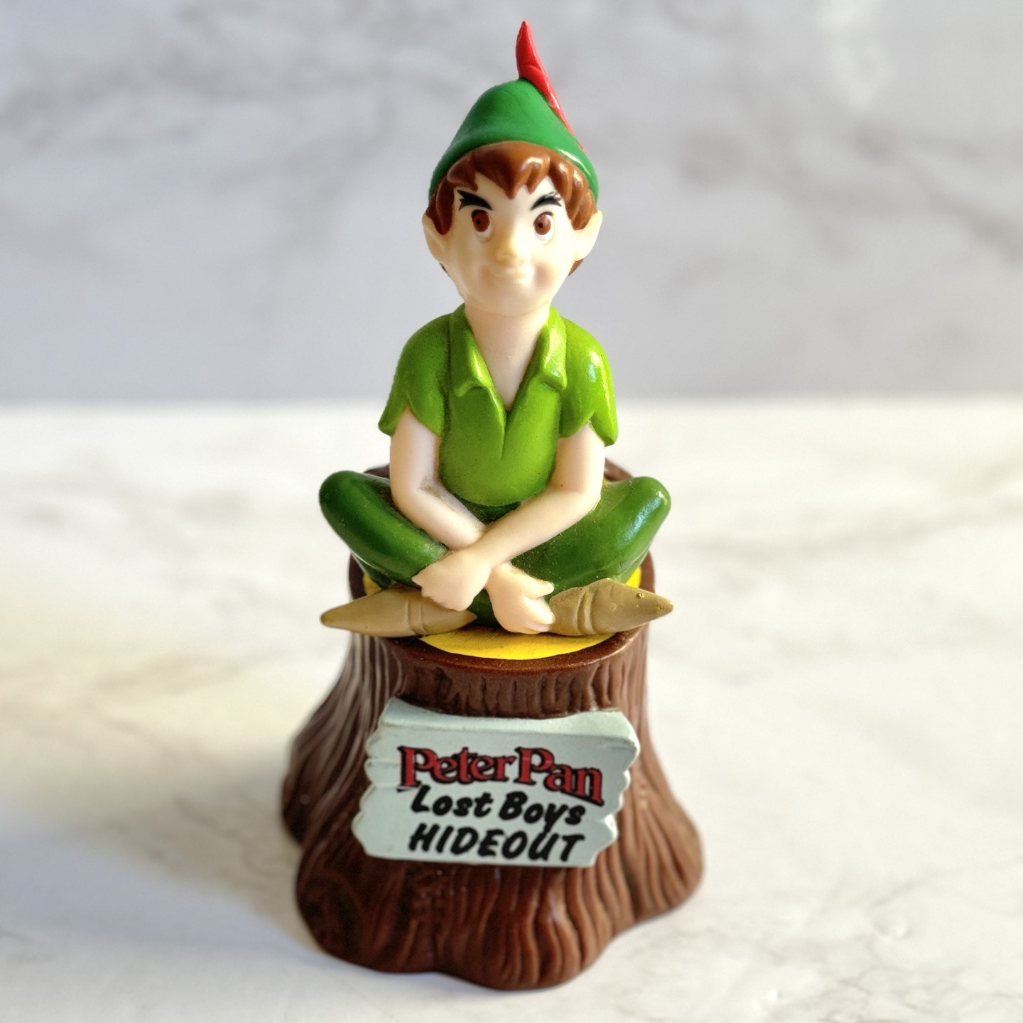 Vintage 1990s Vinyl/PVC Peter Pan Sitting On Lost Boys Hideout Stump Bank
