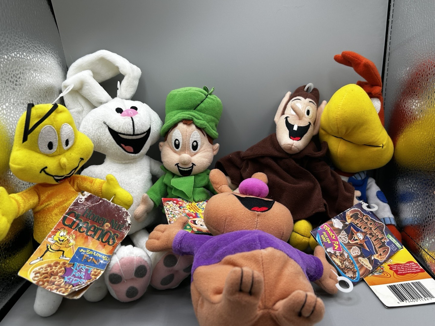General Mills stuffed animals from 1997 and one Kellog Tony the tiger