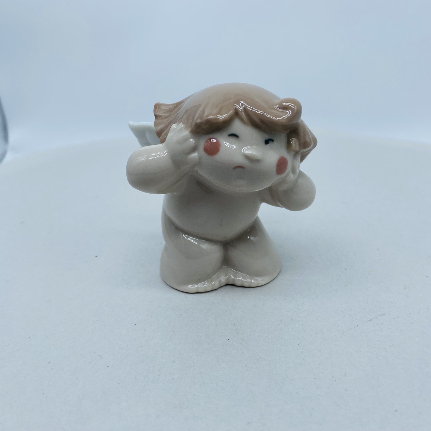 #1424 NAO Lladro Cheeky Cherub Angel covering his ears