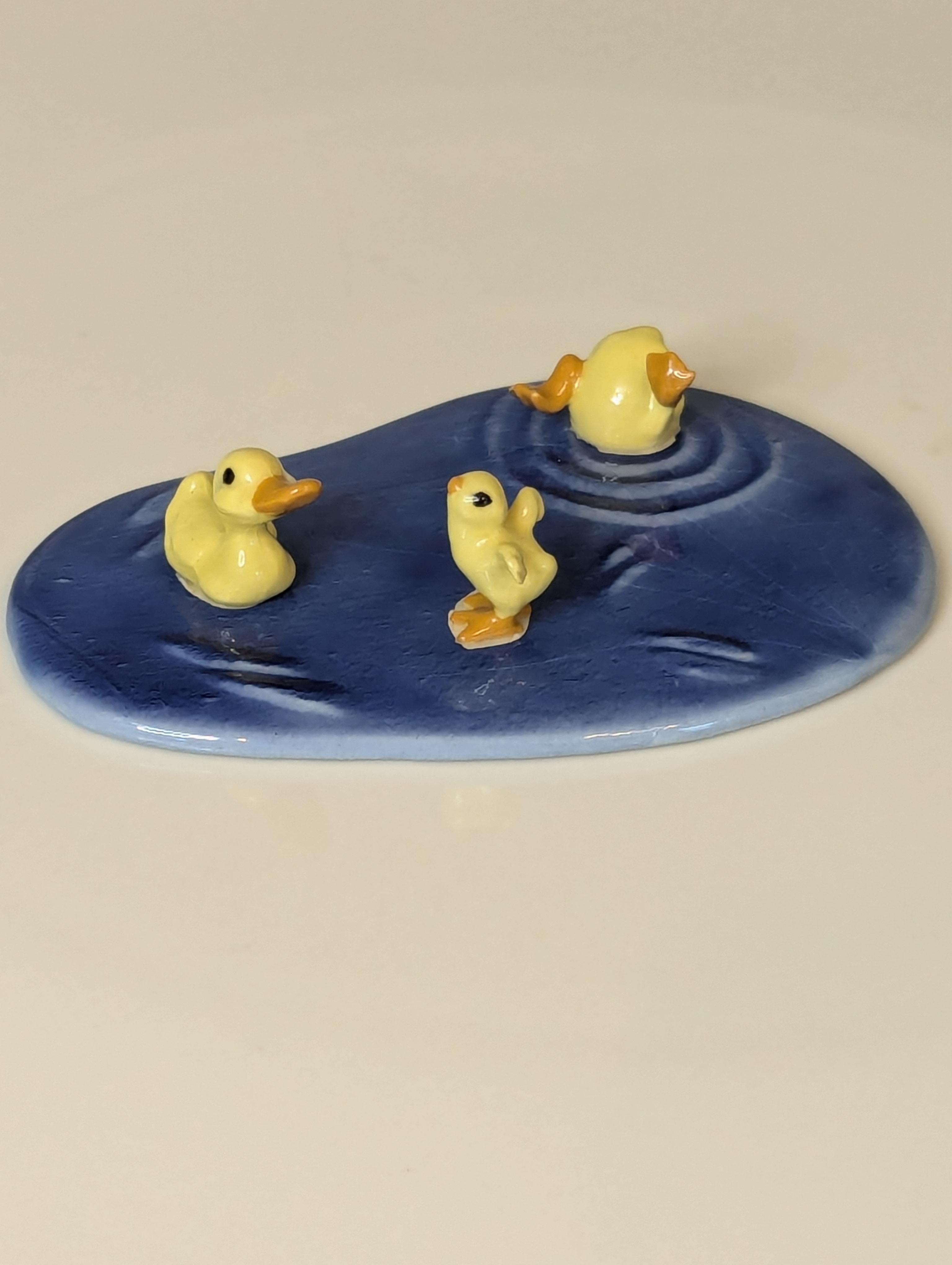 Vintage Ceramic Duck Figurines on Blue Pond, Whimsical Home Decor