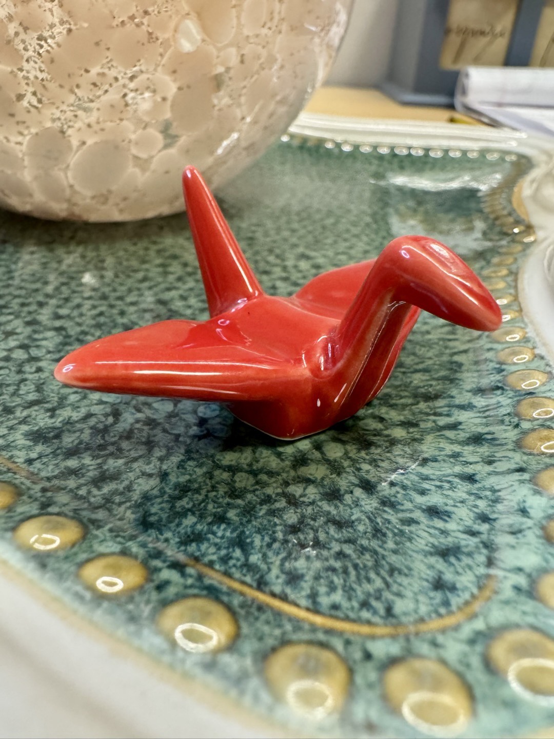 Mini red, ceramic origami crane