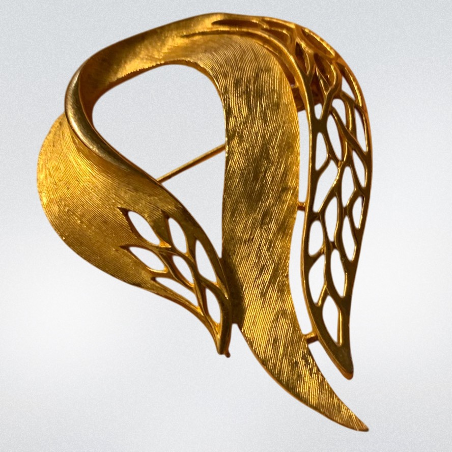 LC Marked Gold Tone Swirl Design With Cutouts