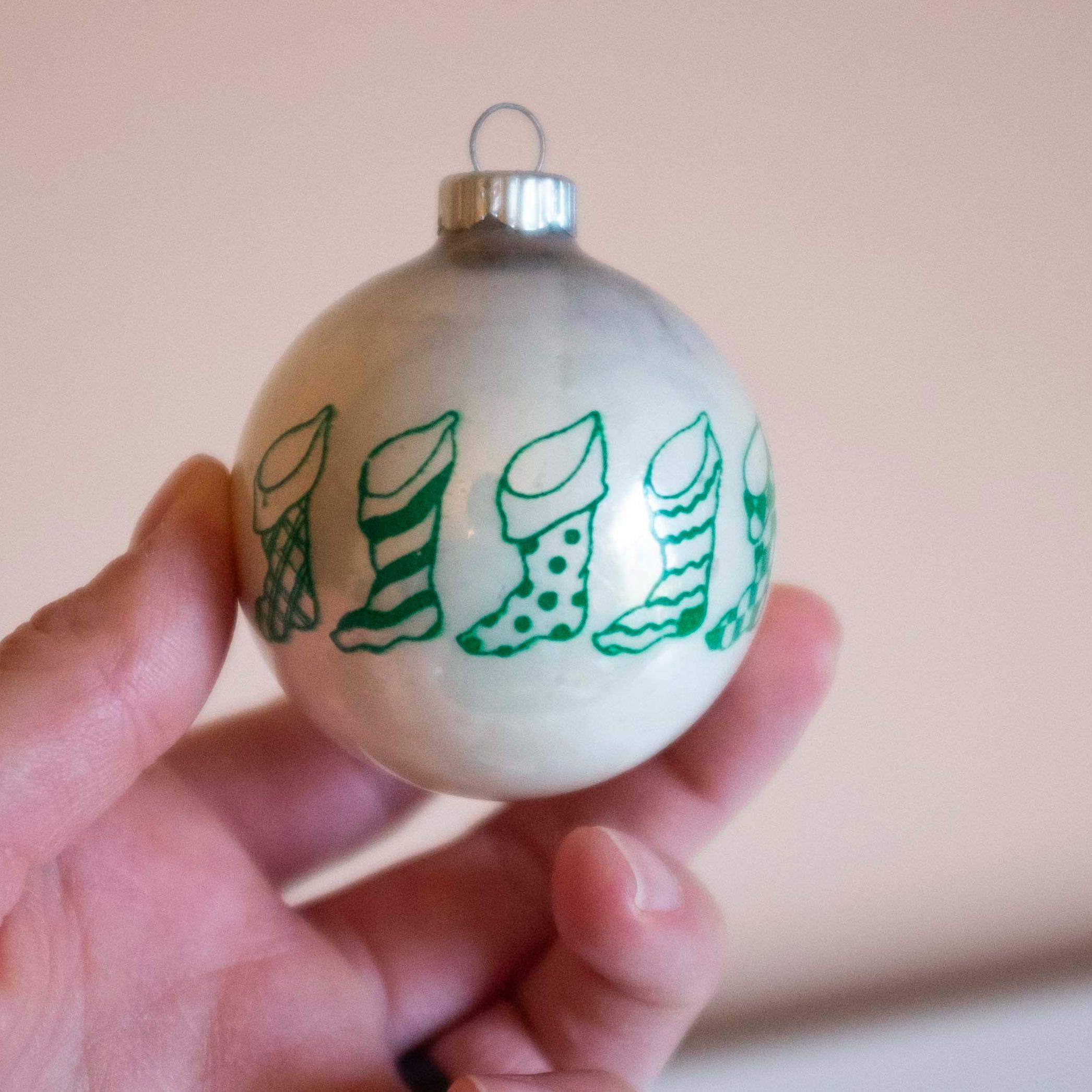 White Shiny-Brite bulb with green stockings