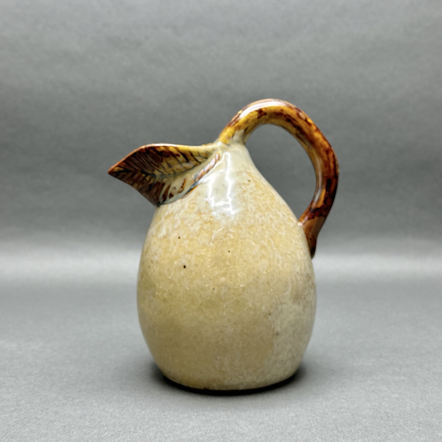 Handcrafted Ceramic Pear-Shaped Pitcher With Leaf Handle & Spout