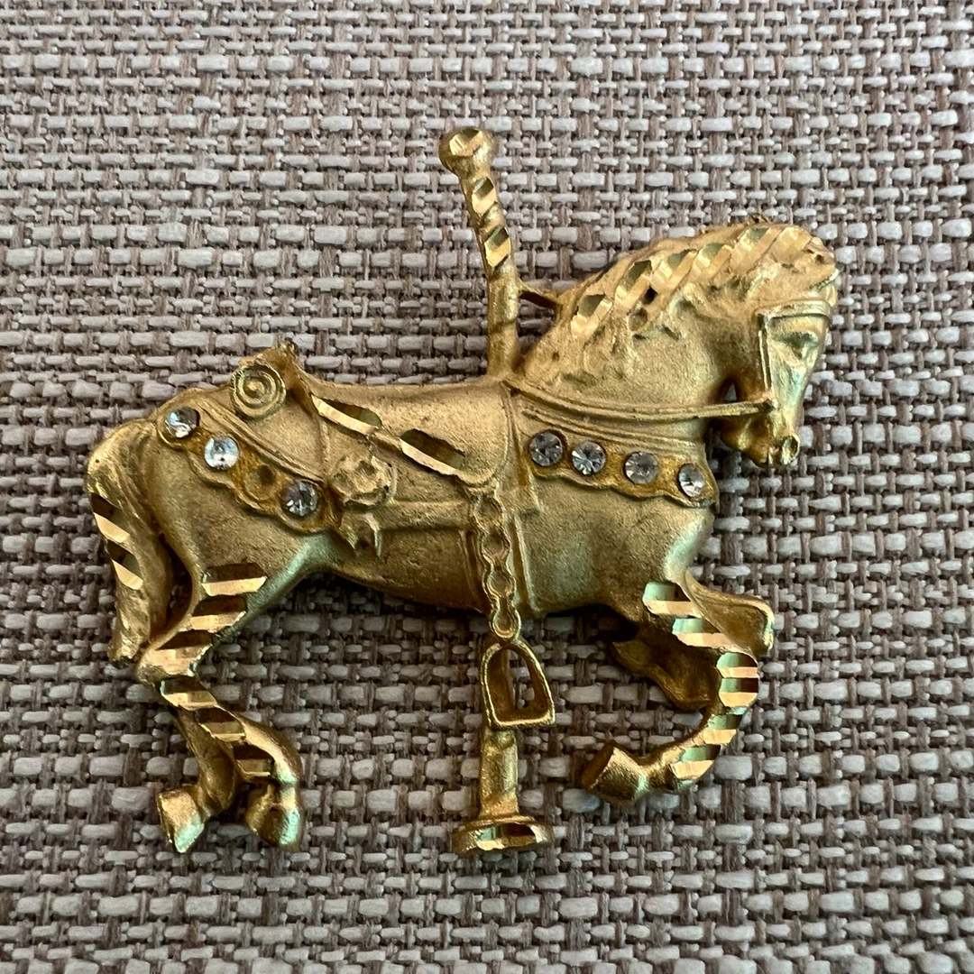 39. Carousel Horse Goldtone brooch.