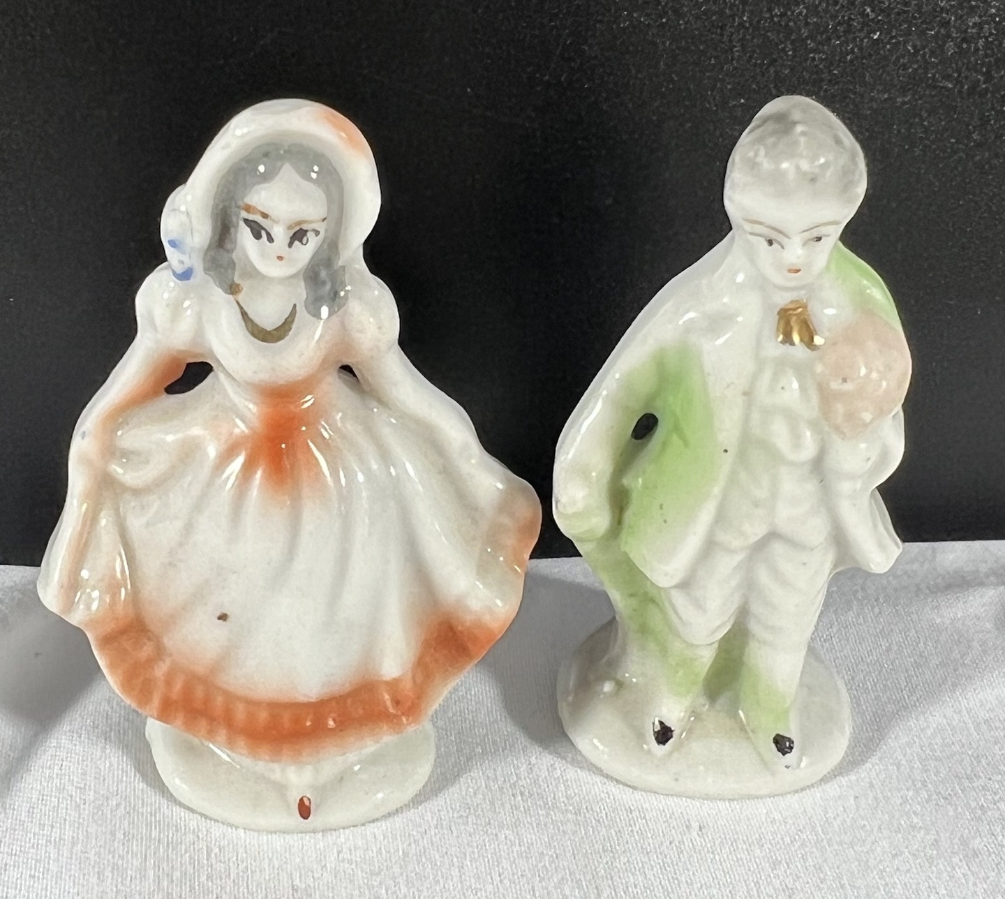 Miniature Porcelain Victorian Man And Woman Figurines.