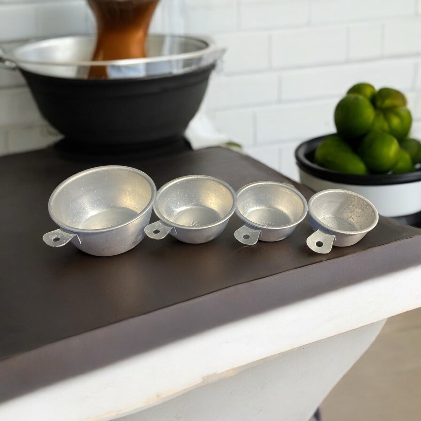 VTG SET OF 4 ALUMINUM MEASURING CUPS W/RIVETED TAB HANDLES