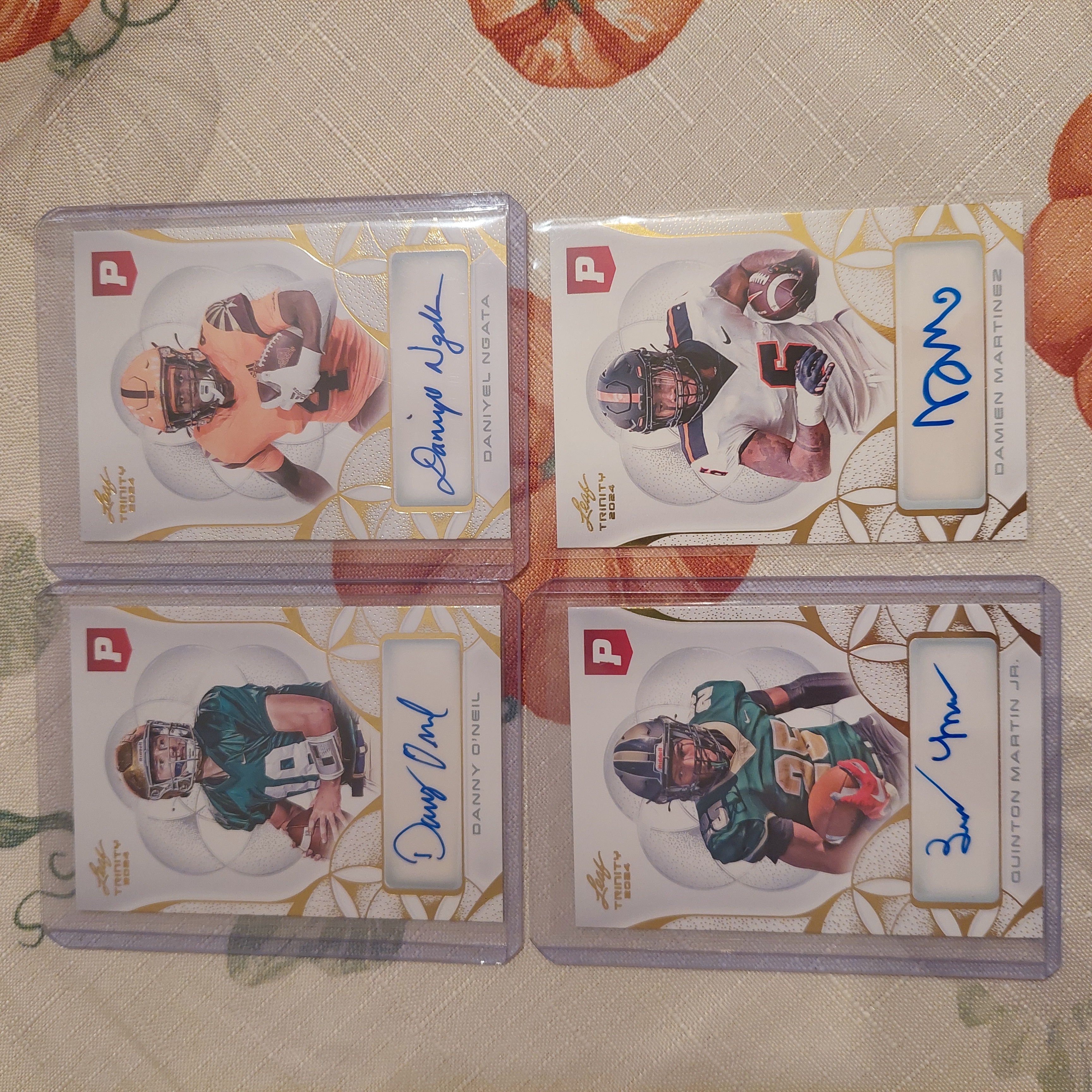Lot of 21 college football cards. 4 auto's, 1 #'d, +. Letters M N O.