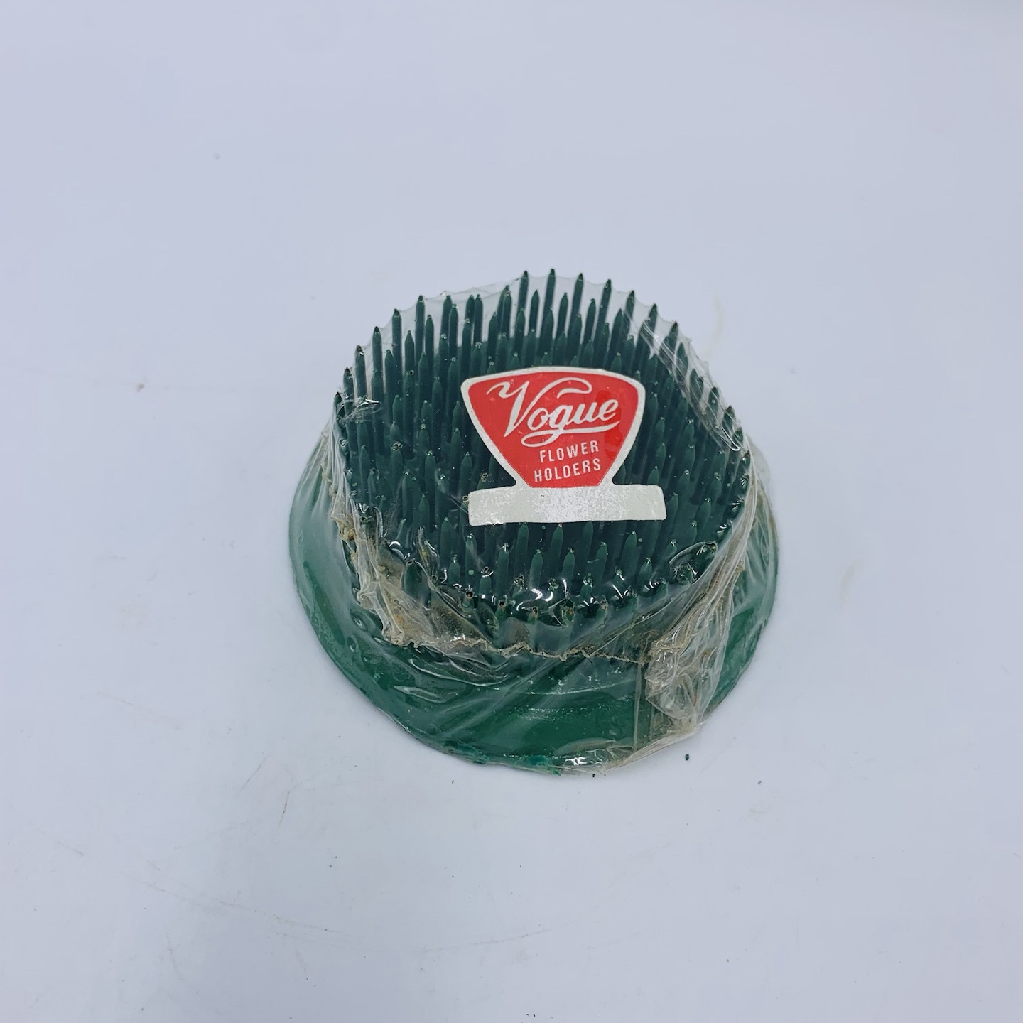 21. Vintage New In Package Vogue Green Metal Flower Frog