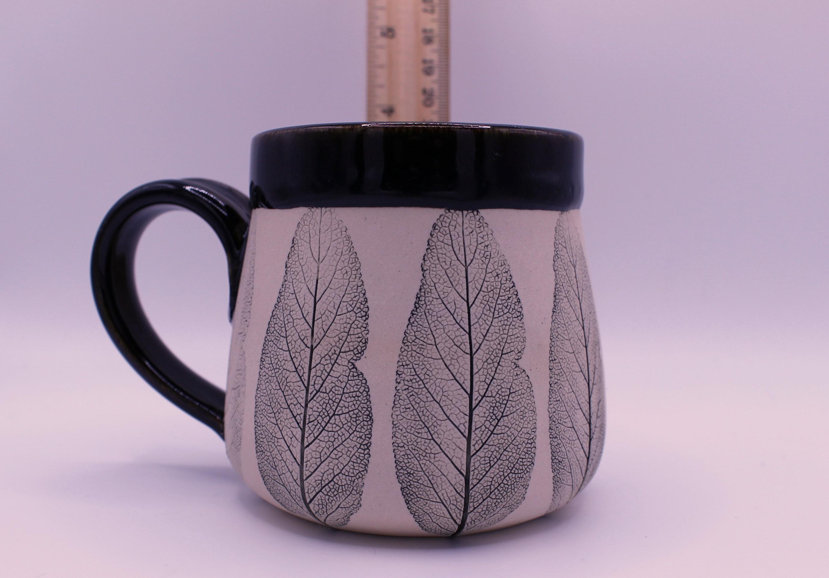 Artist Signed Leaf Design Pottery Mug. Matte sand and glossy black ...