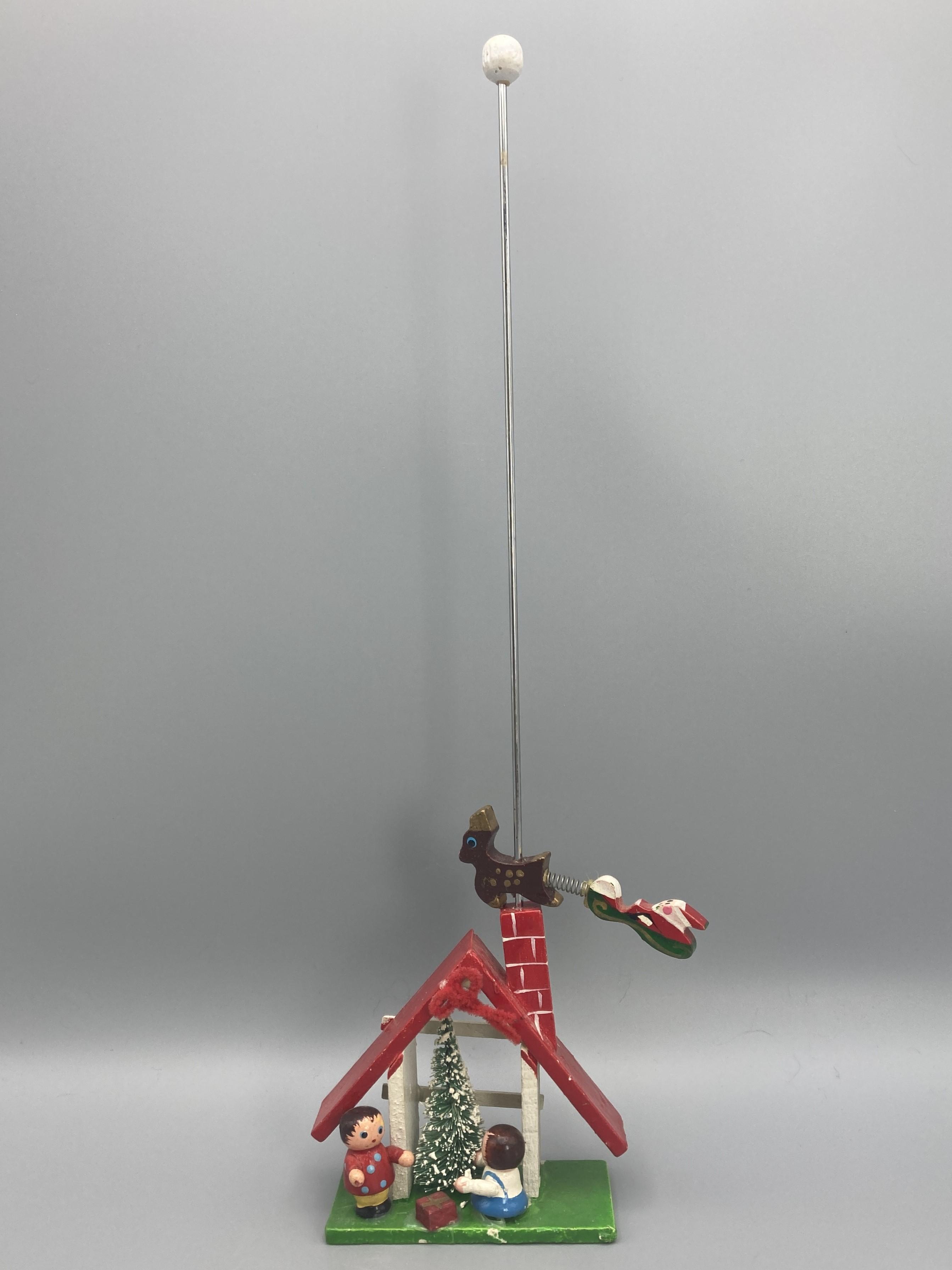 Wooden Santa on Spring Bouncing Down Pole to Chimney, Gravity Movement ...